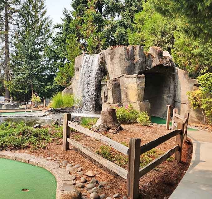That waterfall backdrop turns mini golf into something resembling a nature documentary with scorecards.