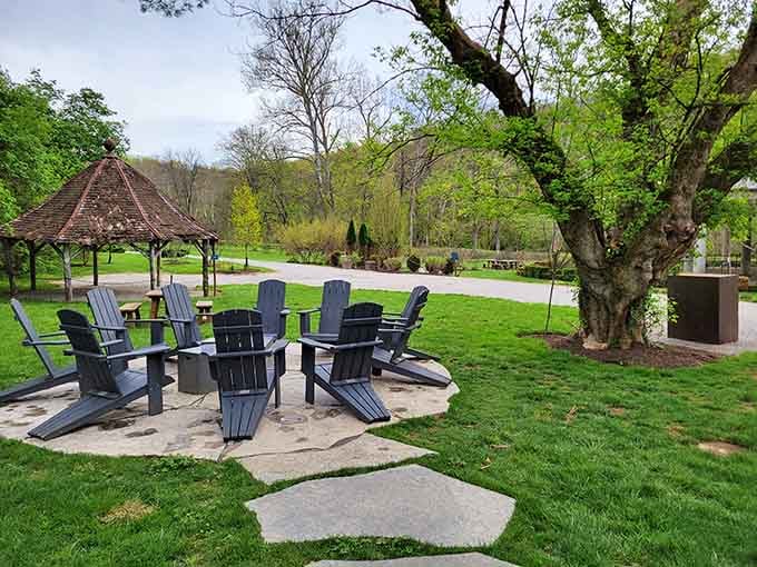 Adirondack chairs scattered across the lawn invite you to sit, sip, and pretend you live here full-time now.