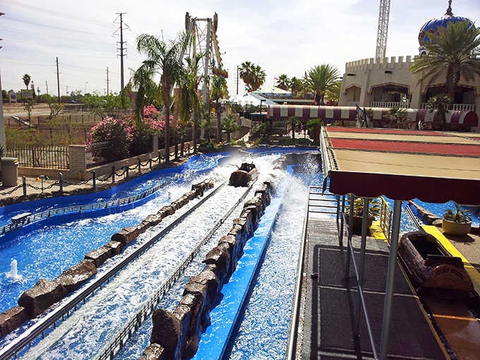 The log flume's final splash guarantees someone's getting soaked, and that someone is probably sitting in front.