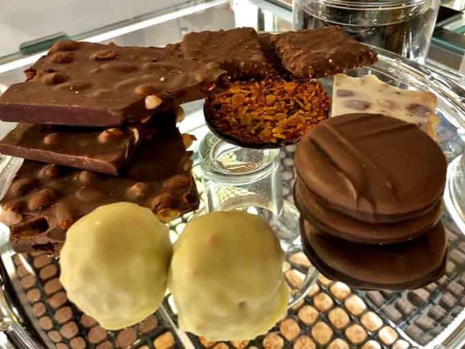 An assorted chocolate display that looks like edible jewelry, proving some treasures are meant to be devoured.