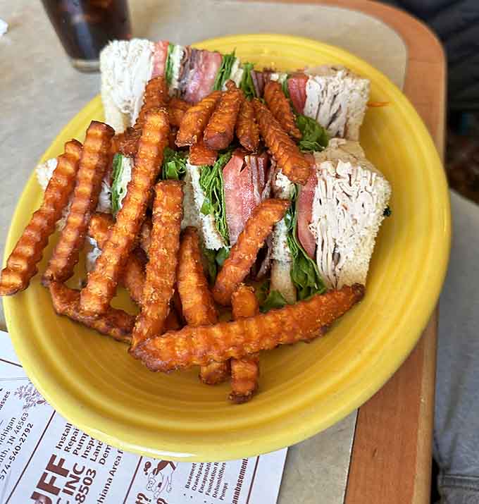 That club sandwich is stacked higher than your expectations, and somehow it still manages to exceed them all.