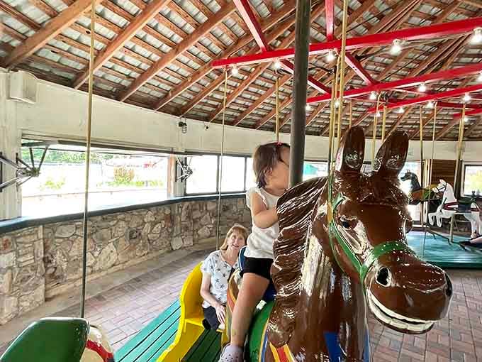 That glossy brown horse has seen generations of joy, and this young rider is adding another chapter to its story.