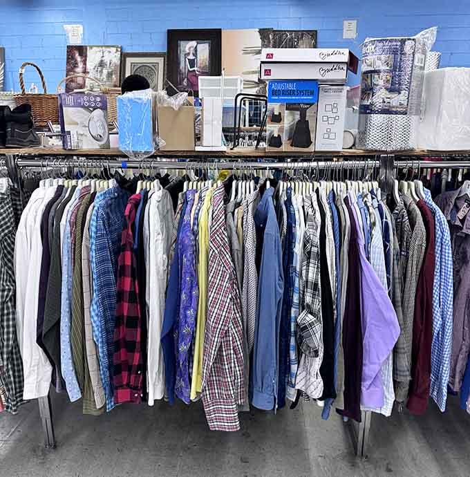Button-downs and flannel shirts organized neatly, proving that someone else's closet cleanout is your wardrobe goldmine today.