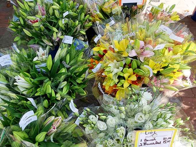 Lilies and lisianthus bring enough color to make your kitchen table forget it's not a fancy restaurant centerpiece.