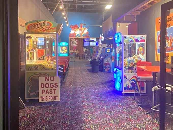 An arcade area lit up like Vegas meets family fun night, because shopping apparently needed a side quest option.