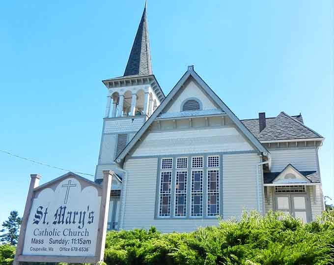 St. Mary's Catholic Church steeple reaching skyward, a landmark that's been part of countless family photographs and memories.