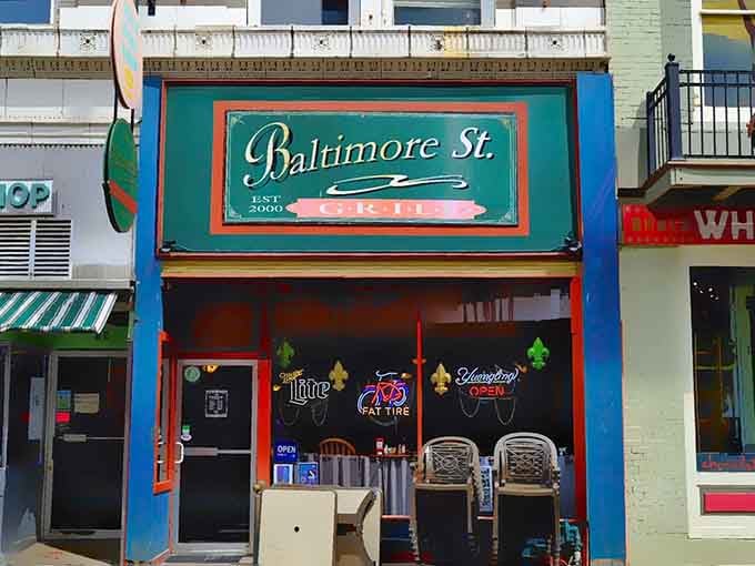 Baltimore Street's colorful storefront beckons with neon promises of comfort food and local hospitality done right.