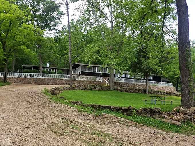 Historic park buildings nestle among the trees, blending seamlessly with the natural surroundings.