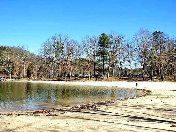 A sandy beach in the mountains feels like someone mixed up their vacation plans and accidentally created something perfect.