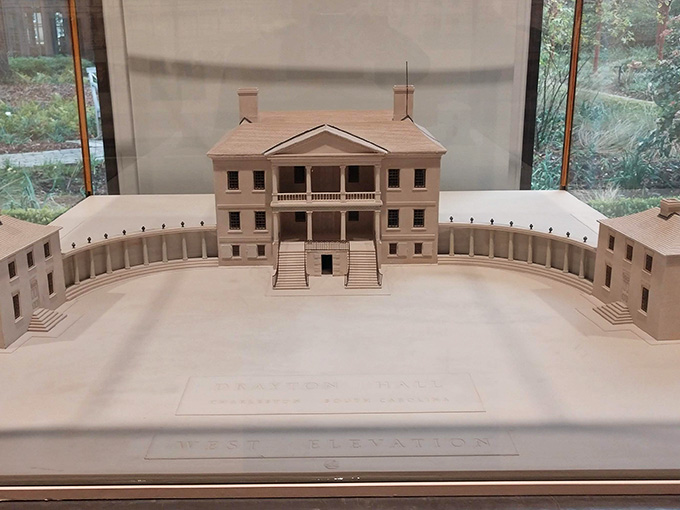 This architectural model shows the full scope of the estate, helping visitors understand the complete plantation layout.