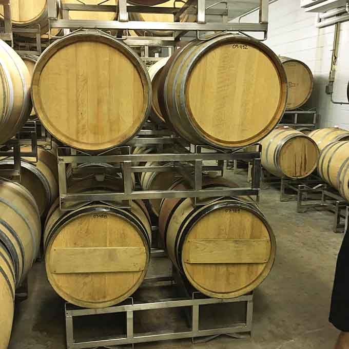 Oak barrels patiently aging tomorrow's favorite wines while you explore today's stellar selections.