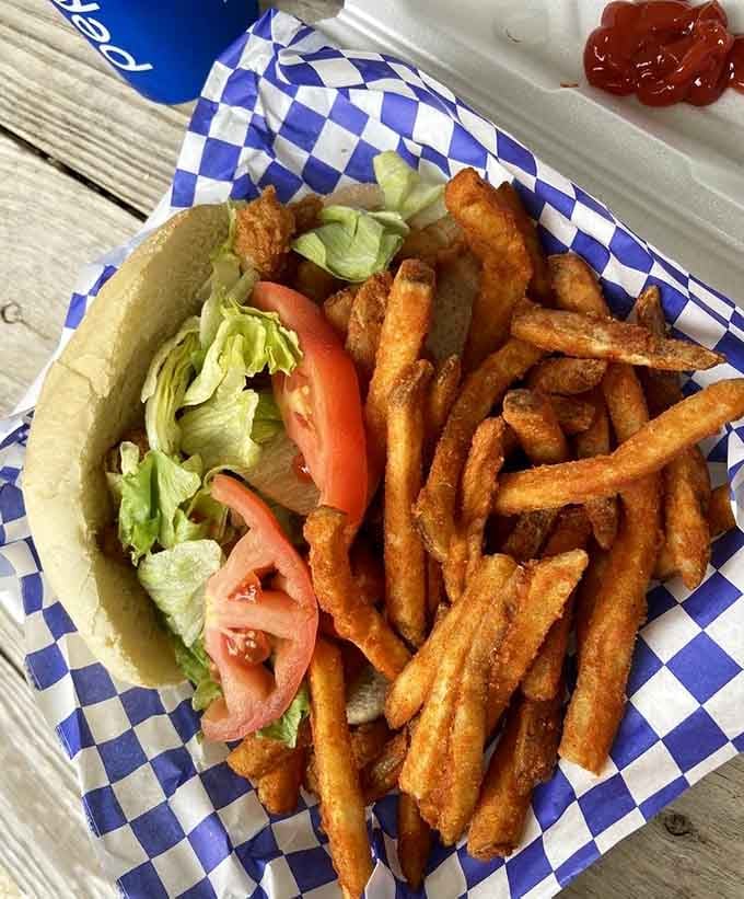This shrimp po'boy with crispy fries looks like the kind of lunch that changes your entire perspective on sandwiches.