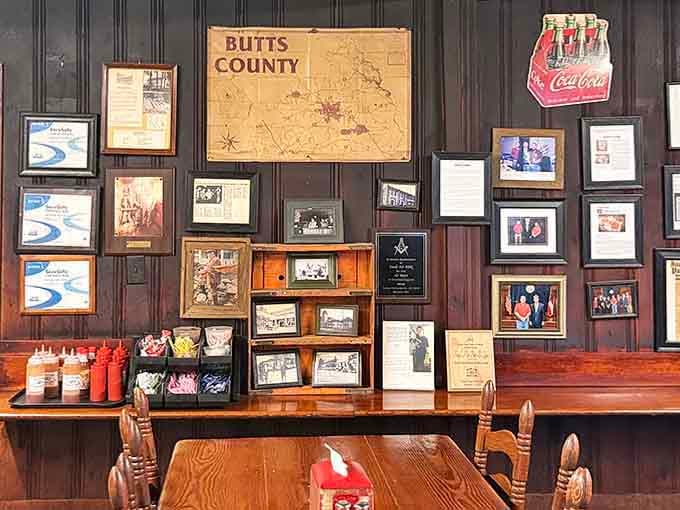 Walls decorated with local history and memorabilia, including a Butts County map that's seen more barbecue runs than rush hour.