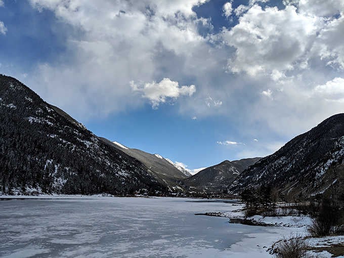 When the lake freezes over, it's like nature decided to add another layer of magic to an already enchanting setting.