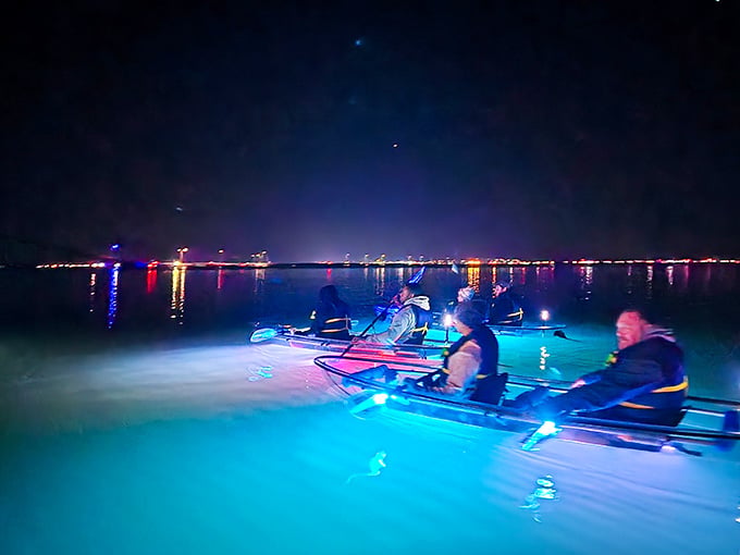 City lights reflecting off glowing kayaks creates a scene that cameras love and memories cherish forever after.