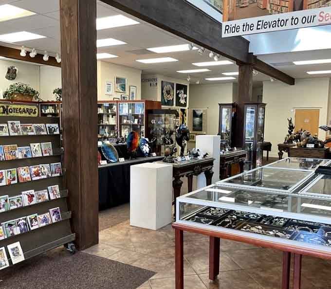 Notecards and bronze sculptures mingle with books, proving this place takes the "art gallery" part seriously.