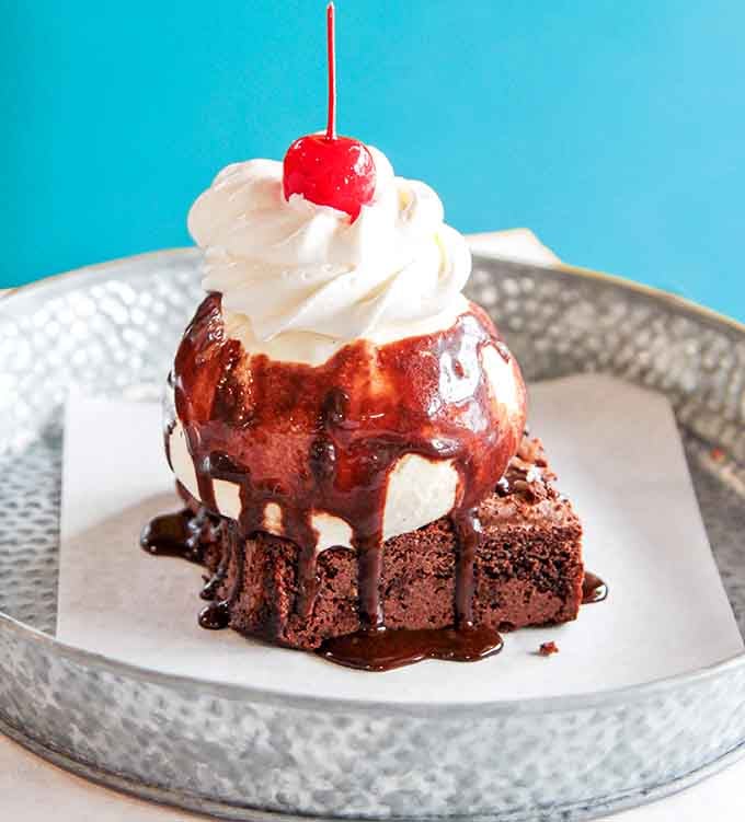 The Hot Brownie Sundae: warm, cold, chocolatey, and completely necessary after all that savory goodness.