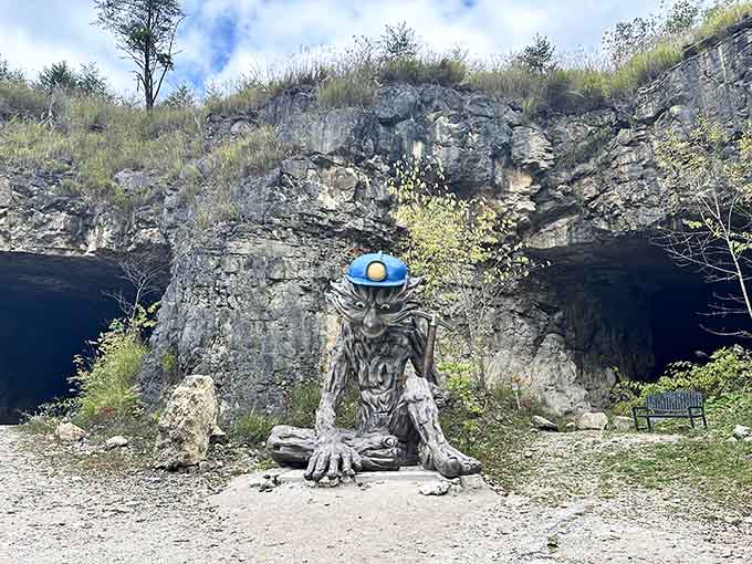 This cheerful cave guardian greets visitors topside, proving that even underground adventures need a friendly mascot with style.