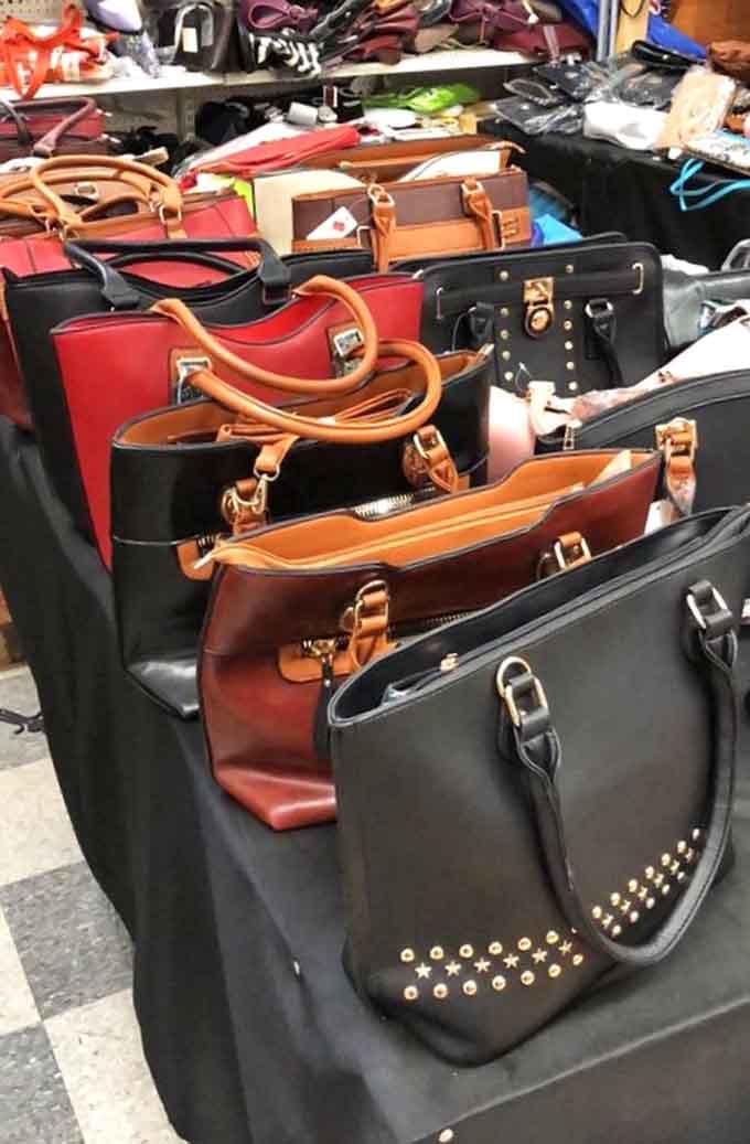 Handbags lined up like leather soldiers, each one ready to carry your essentials with more style than function.