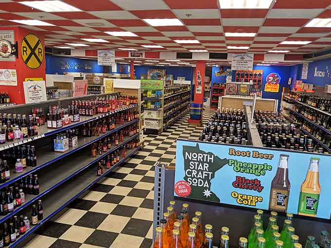 Aisles of bottled soda stretch endlessly, proving that someone somewhere invented a flavor for literally everything, including mistakes.