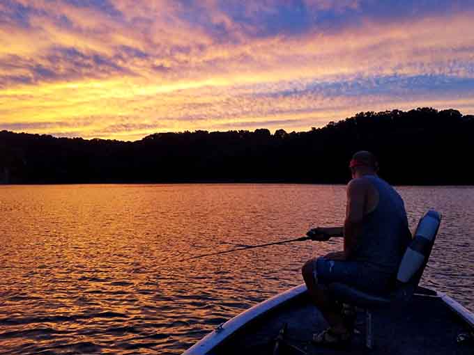 Sunset fishing on calm waters offers the kind of peaceful meditation that makes you forget your phone exists back home.