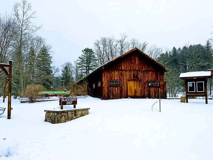 The restored blacksmith shop in winter looks like a Christmas card that forgot to include the commercialism.