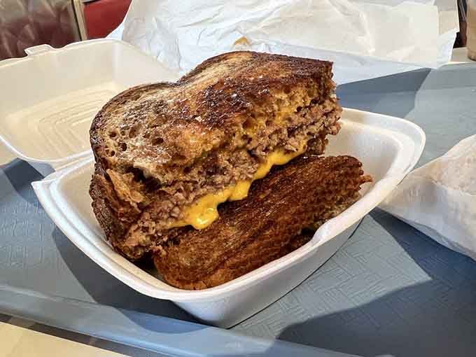 The patty melt on grilled rye proves that sometimes the best things happen when cheese meets bread meets griddle.