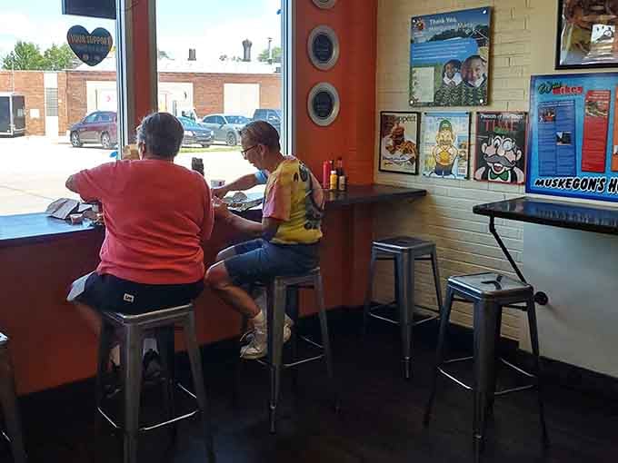 Window seating where strangers become friends over shared appreciation for really good food and local sports teams.