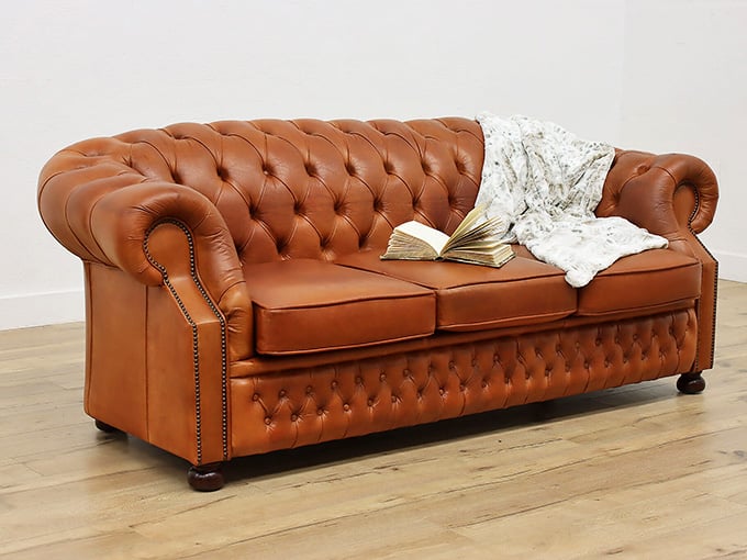 This tufted leather Chesterfield sofa is basically a first-class ticket to an afternoon of pure comfort.