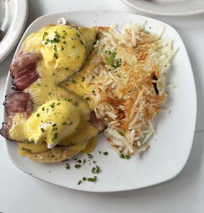 Eggs Benedict with perfectly poached eggs and hollandaise sauce that doesn't taste like it came from a packet.