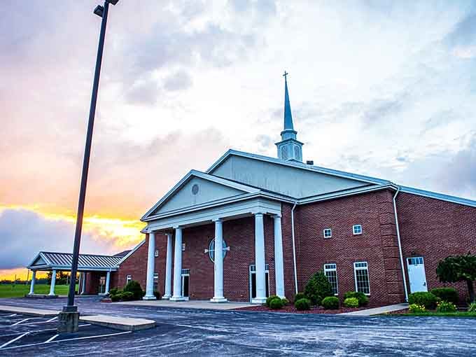 Sunset bathes this church in golden light, creating a scene so picturesque it belongs on a greeting card your aunt would send.