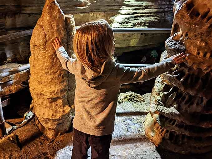 Young explorers discovering that touching ancient formations is tempting but forbidden, like cookies before dinner but with geological consequences.