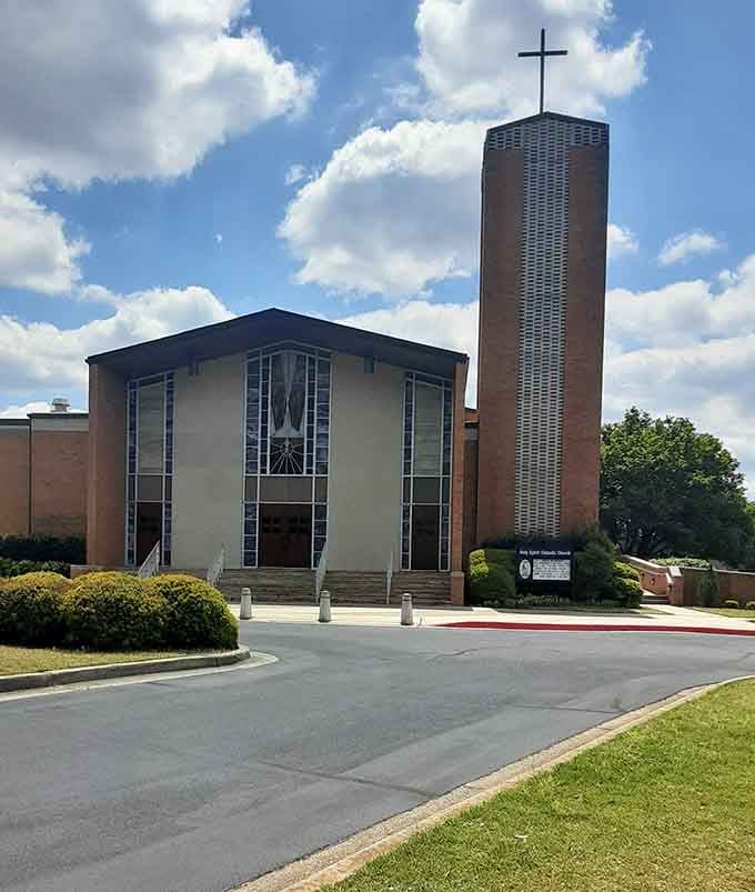 Holy Spirit Catholic Church's distinctive tower reaches skyward, a striking landmark in Huntsville's diverse architectural landscape.