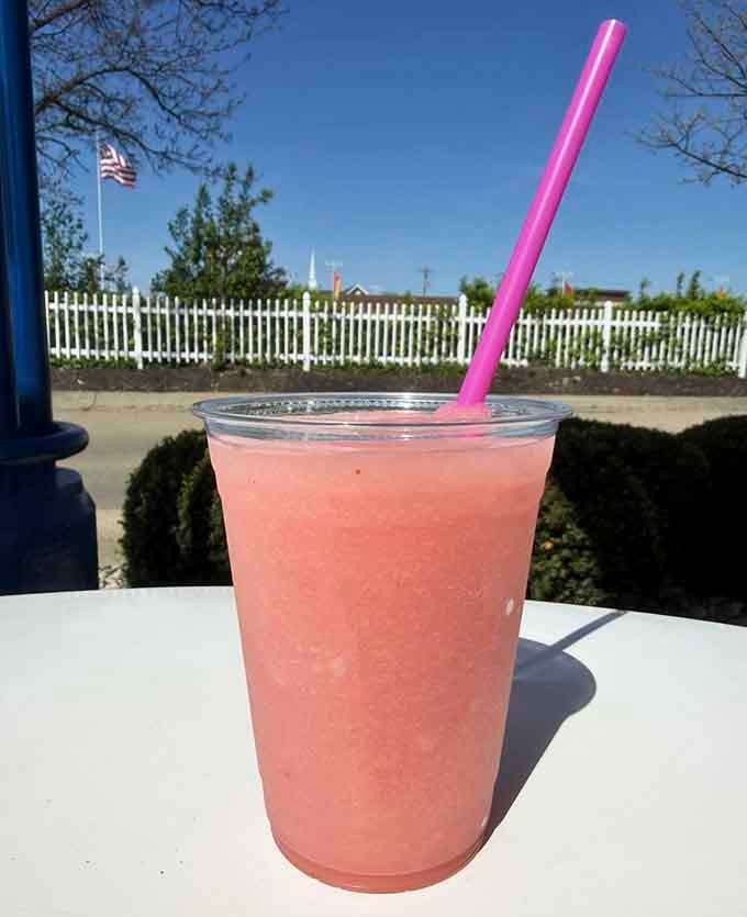 Pink slush catches the sunlight like liquid summer, refreshing enough to make you forget every worry you brought.