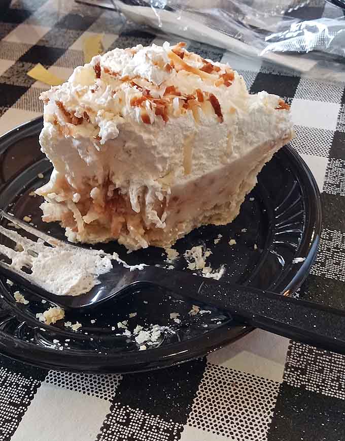 Coconut cream pie piled this high with toasted coconut is basically edible happiness on a plate, no exaggeration needed.