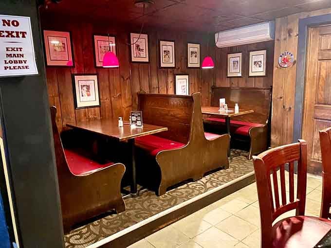 Booth seating with character, where the red vinyl has witnessed countless celebrations and comfort food victories.