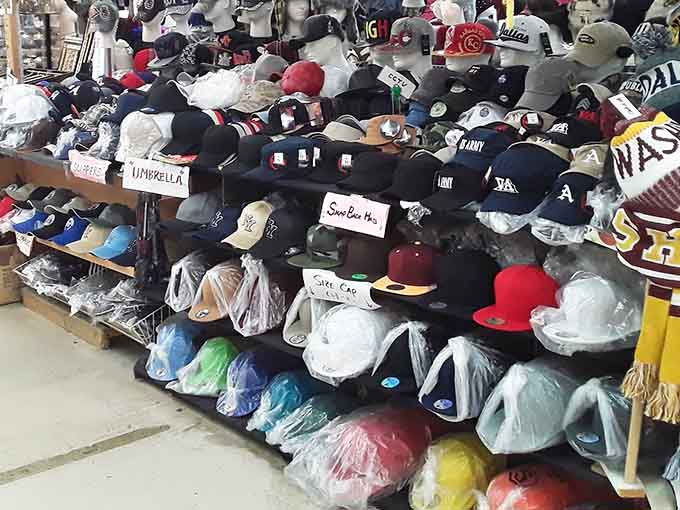 Baseball caps stacked high represent every team, brand, and style you could possibly want for your collection.