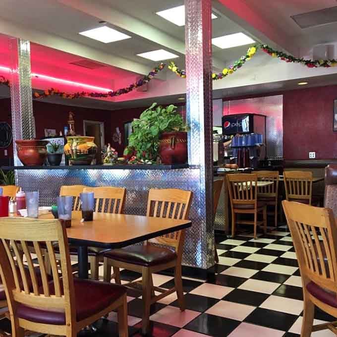 Classic checkered floors and cozy chair seating create that timeless diner vibe with a Mexican twist.