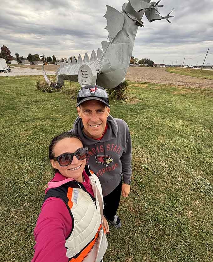 Nothing says "successful road trip" quite like a selfie with a patriotic dragon looming overhead behind you.