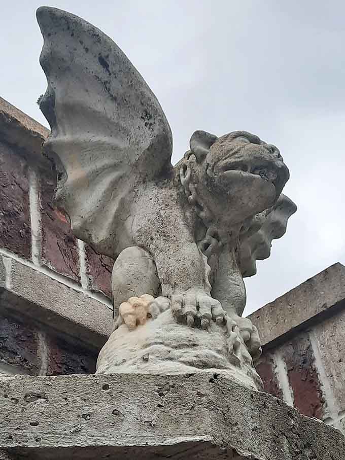 Weathered gargoyles perch watchfully on the castle corners, their stone faces showing character earned through countless seasons.
