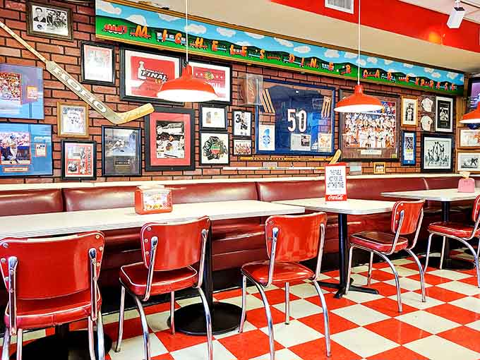Sports memorabilia and vintage signs create a visual feast before you even order your actual feast.