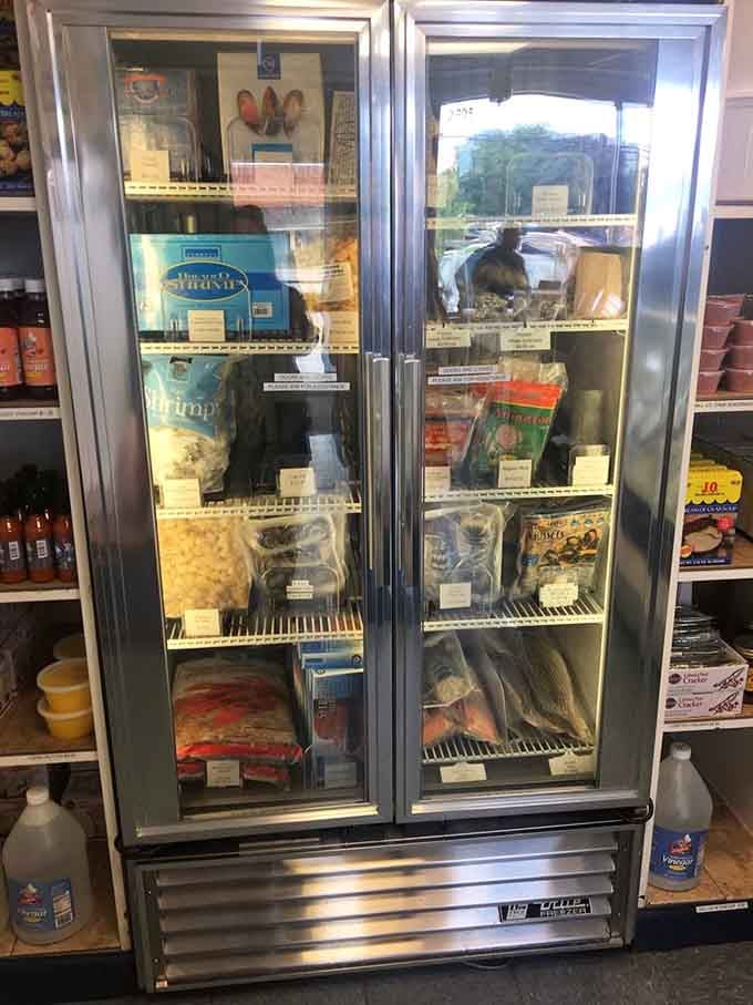 The frozen seafood case stands ready like a backup singer, supporting the fresh stars of the show with quality options.