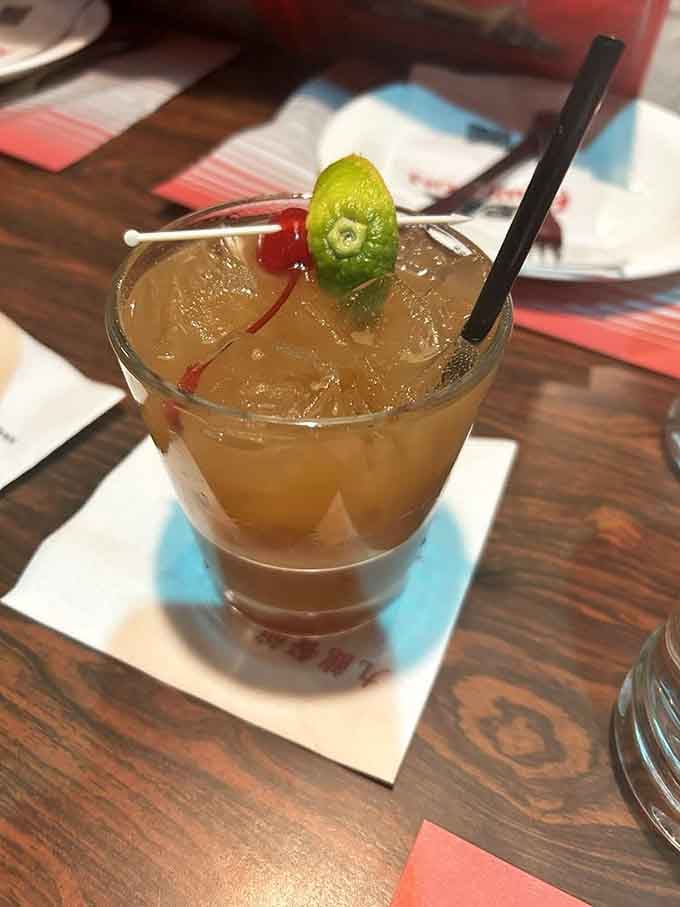 This Mai Tai garnished with lime and cherry promises tropical vibes despite the Massachusetts zip code outside.