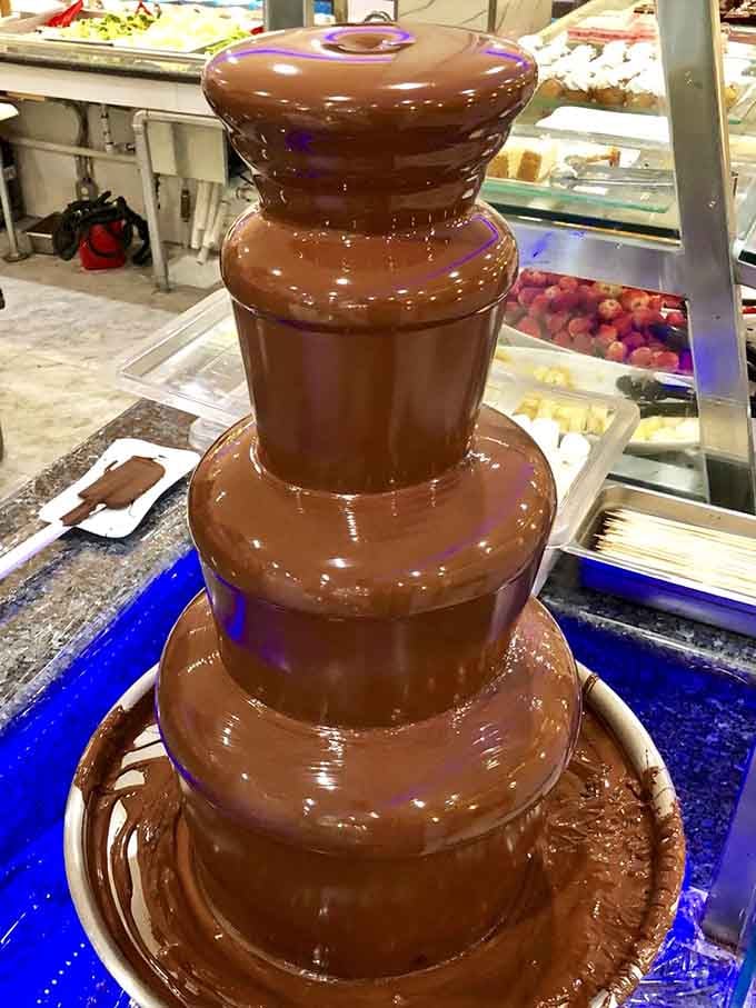 That chocolate fountain cascading like a delicious waterfall, tempting you to dip everything within arm's reach into it.