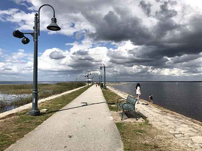 Lakefront Park's pier stretches into the water like an invitation you'd be foolish to ignore on a day this beautiful.
