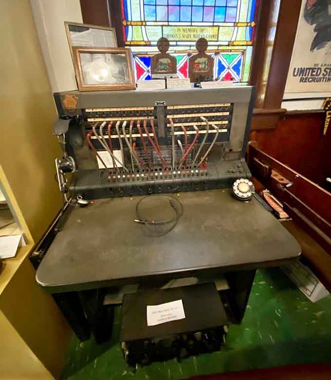 An antique telephone switchboard where operators once connected every call, gossip, and emergency in town with actual human hands.