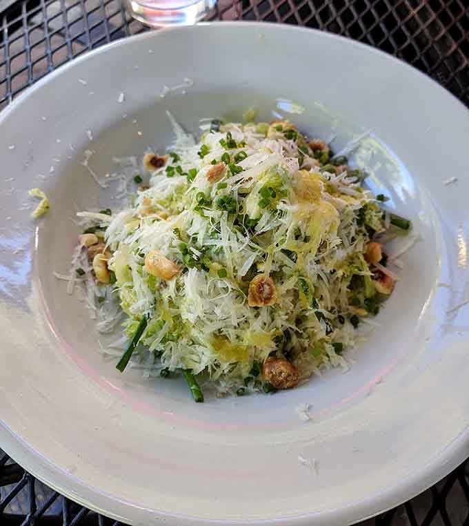 Brussels sprouts so good they'll convert the skeptics. Shaved thin, dressed perfectly, topped with cheese and nuts.
