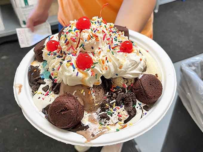 This sundae is taller than some toddlers and probably contains more joy than most therapy sessions combined.