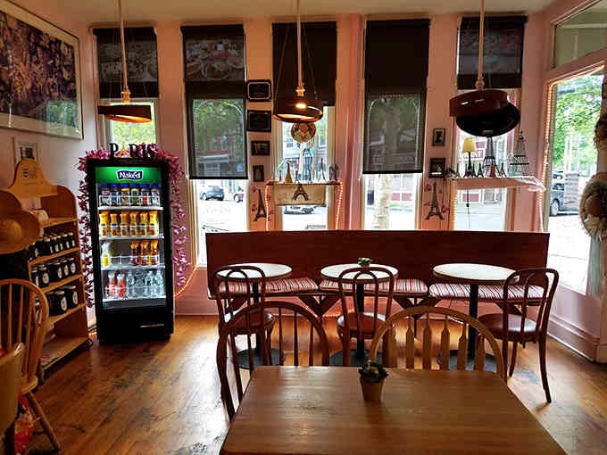 Copper pendant lights and wooden tables create that cozy neighborhood bakery atmosphere you've been craving forever.