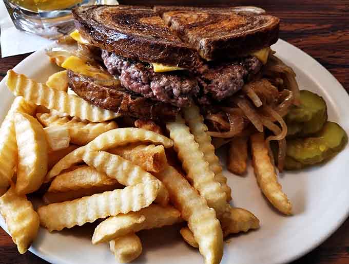 The patty melt of your dreams, oozing with cheese and caramelized onions between perfectly grilled bread slices.